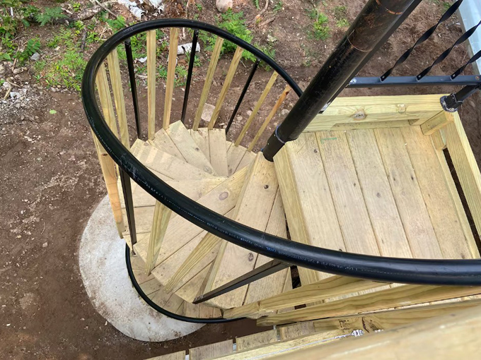 The spiral staircase leads visitors up to this elevated retreat, adding to the sense of ascending into adventure.