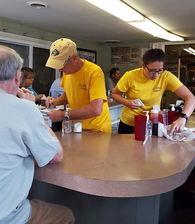 The dedicated staff works with practiced efficiency, turning out perfect burgers with the kind of skill that only comes from years of experience.