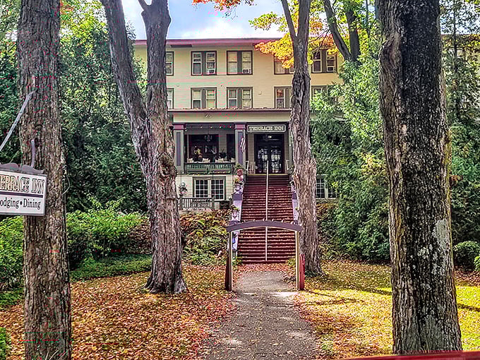 The Terrace Inn peeks through autumn foliage, its wide porches and vintage charm inviting visitors to step back into a more gracious era.