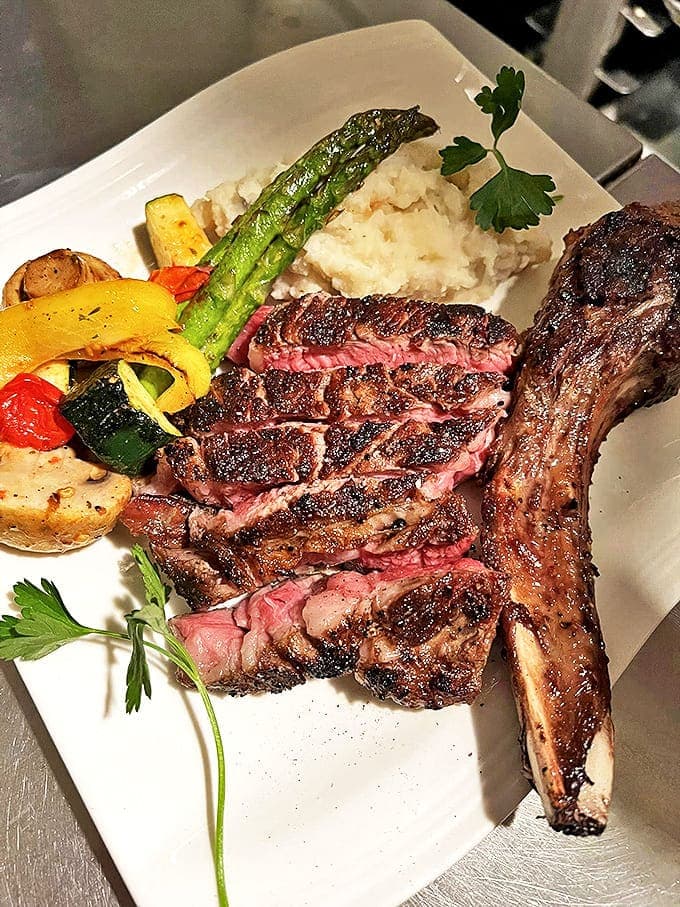 Tomahawk Steak and Mashed Potatoes: This isn't just dinner; it's a carnivorous masterpiece&mdash;a perfectly seared tomahawk steak that would satisfy even the most discerning ghostly appetite.