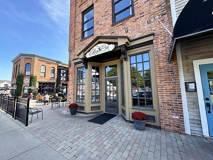 Village Pub's brick exterior hints at the warm conversations waiting inside, where strangers become friends over cold drinks and hot topics.