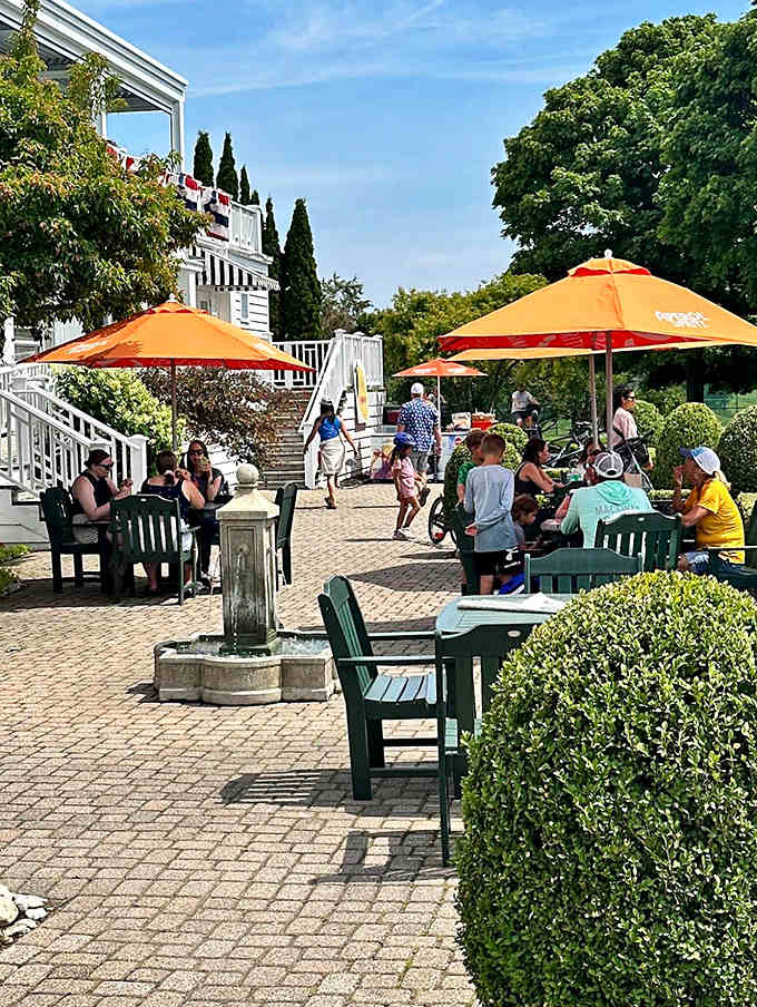 Young visitors pose with one of the garden's bronze characters, creating memories that will last long after they've returned home.