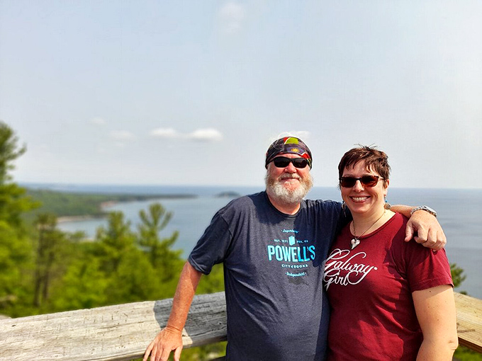 Happy hikers at the summit experiencing that special joy that comes only from conquering a mountain and having photographic evidence to prove it.