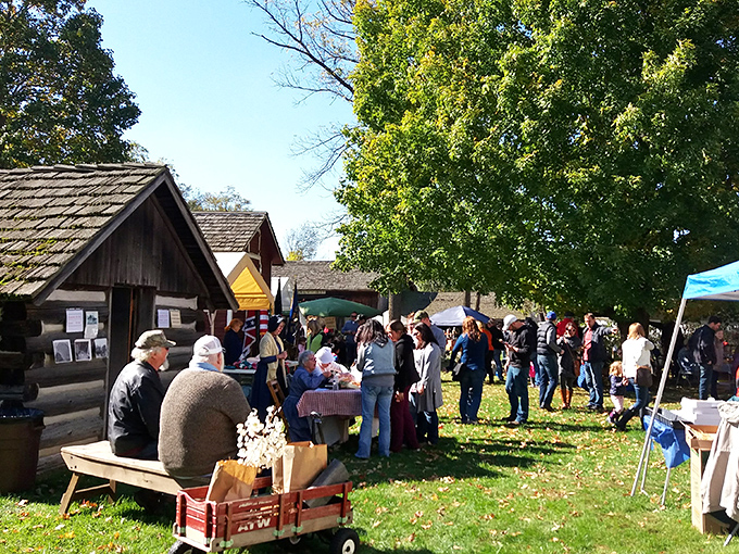 Visitors mingle among historic buildings during special events, discovering community experiences that don't require WiFi passwords.