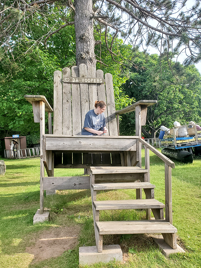 The oversized wooden chair labeled "DA YOOPERS" provides the perfect photo opportunity for travelers looking to document their Upper Peninsula adventure.