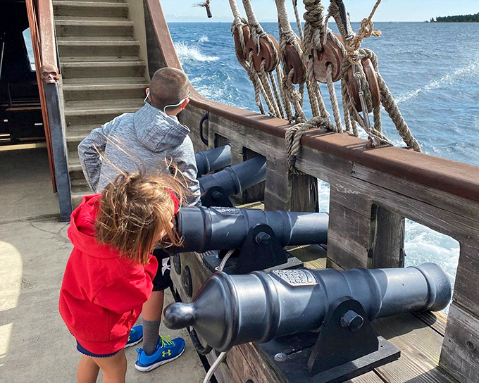 Young pirates take aim with the ship's (harmless) cannons, scanning the horizon for imaginary rival vessels to conquer during the cruise.