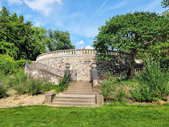 The circular stone terrace offers panoramic views of the estate, like a viewing platform for a masterclass in landscape design.