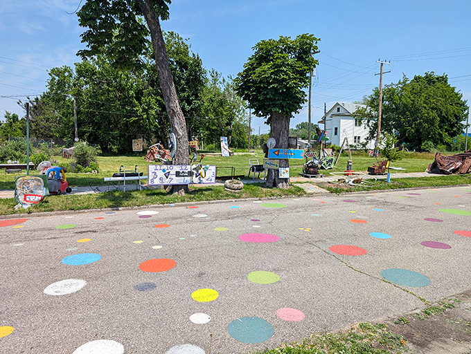 The signature polka dots spill from houses onto the street itself, creating a path that feels like following breadcrumbs through a fairy tale.