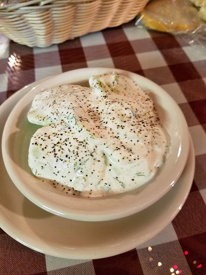 The cucumber salad offers a refreshing counterpoint to heartier dishes &ndash; cool, creamy, and flecked with dill, it's the palate cleanser you didn't know you needed.