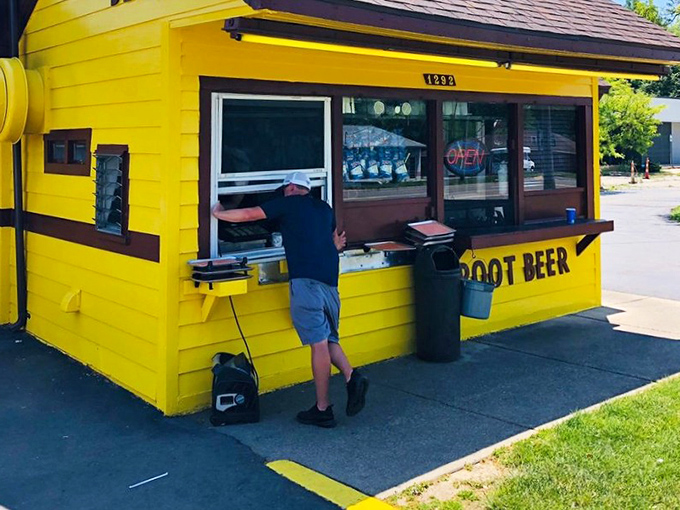 A customer at the window, participating in a Michigan ritual that's remained blissfully unchanged while the world spins madly on.
