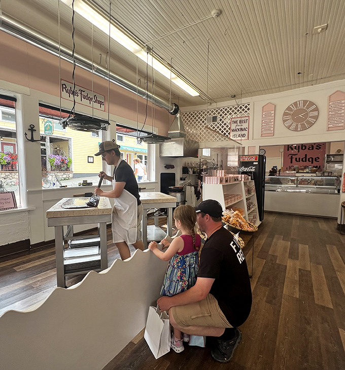 The fudge-making demonstration draws an audience of all ages – proof that watching dessert being born is universal entertainment.