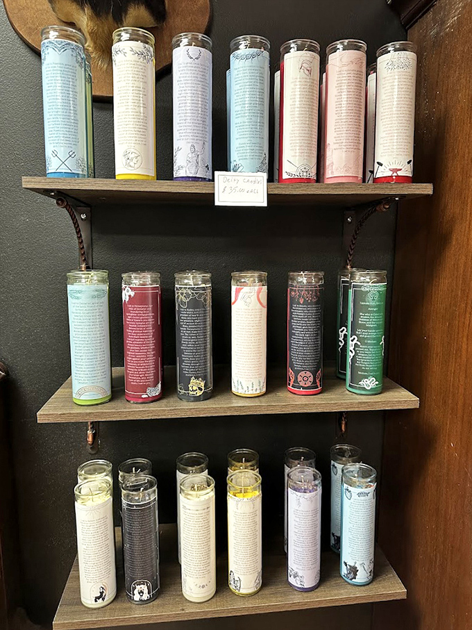 Colorful ritual candles line the shelves, each promising different spiritual benefits for those who believe in their power.