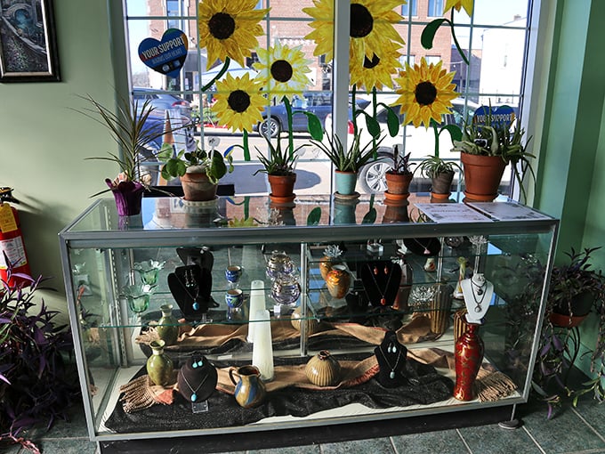 Sunflowers greet visitors at the window display, their cheerful faces a perfect complement to the treasures showcased below.