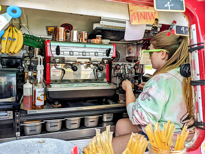 That gleaming red espresso machine is the heart of the operation, pumping out perfectly extracted shots with professional precision and vintage style.