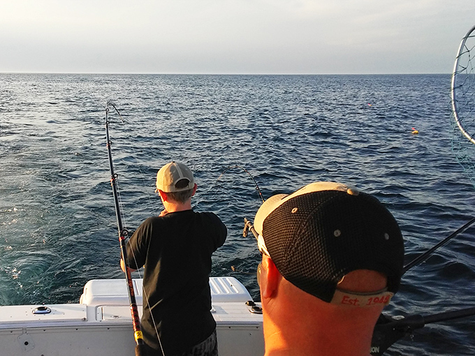 Patience rewarded: Anglers cast their lines into Lake Huron's abundant waters, participating in a timeless ritual against a spectacular backdrop.