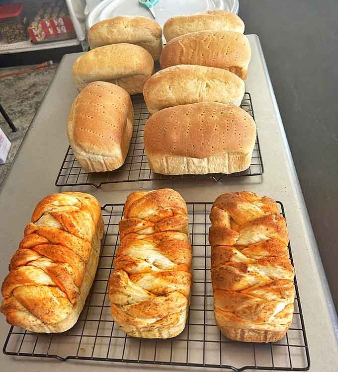 Artisanal loaves stand at attention, their crackling crusts practically begging to become the foundation for your next sandwich masterpiece.