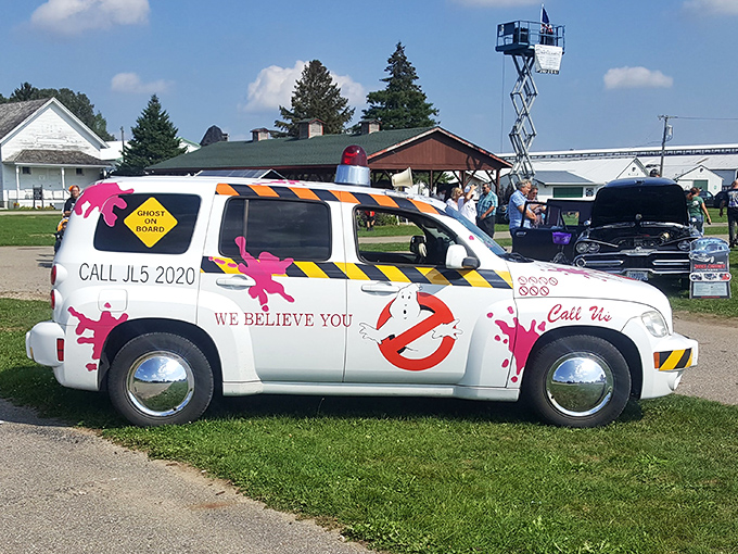 Ghost on board: This spectral passenger seems right at home in a vintage Cadillac, proving some road trips truly are eternal.