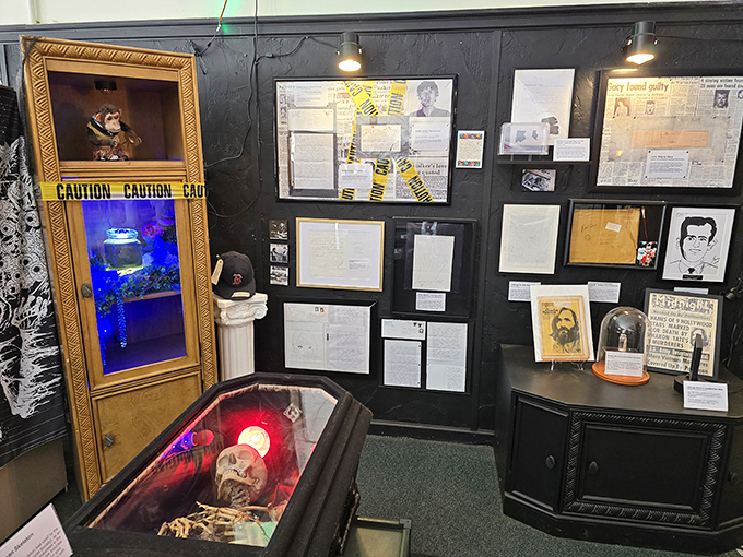 Crime scene aesthetics meet museum curation in this display area, where historical documents share space with the supernatural.