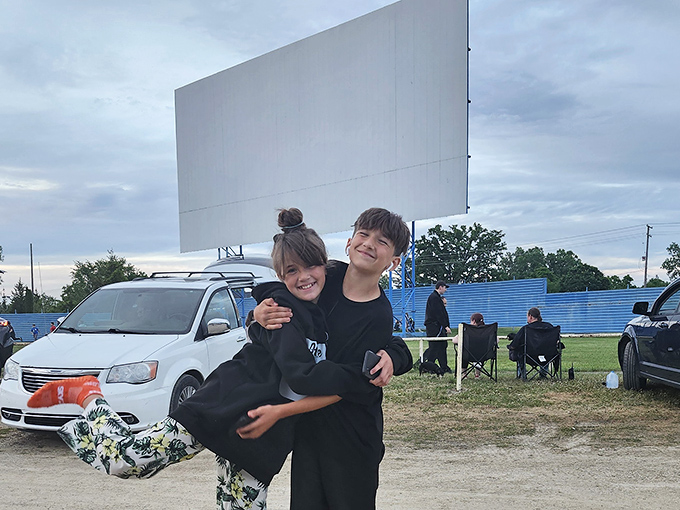 Young moviegoers create memories that will last a lifetime, their excitement as bright as the screen they're eagerly awaiting.