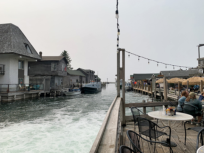 Lakeside seating where the biggest decision is whether to watch the boats or the sunset, and honestly either choice is a winner.