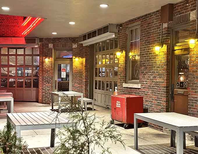 Outdoor Seating: The warm glow of Vinsetta's interior spills onto brick walls and outdoor tables, creating a cozy oasis where Michigan evenings become magical memories.