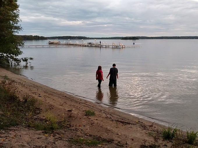 Shoreline serenity: The simple joy of wading into Big Manistique Lake reminds us that sometimes the best vacation moments cost absolutely nothing.