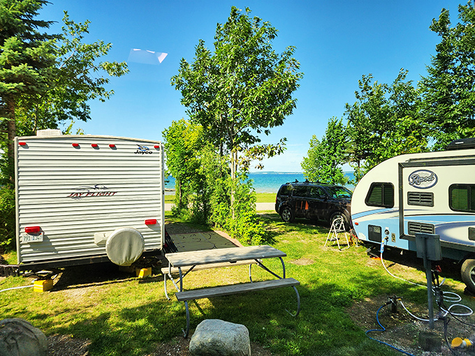 Simple pleasures: A classic camping setup with tent and picnic table &ndash; sometimes the best adventures require nothing more.
