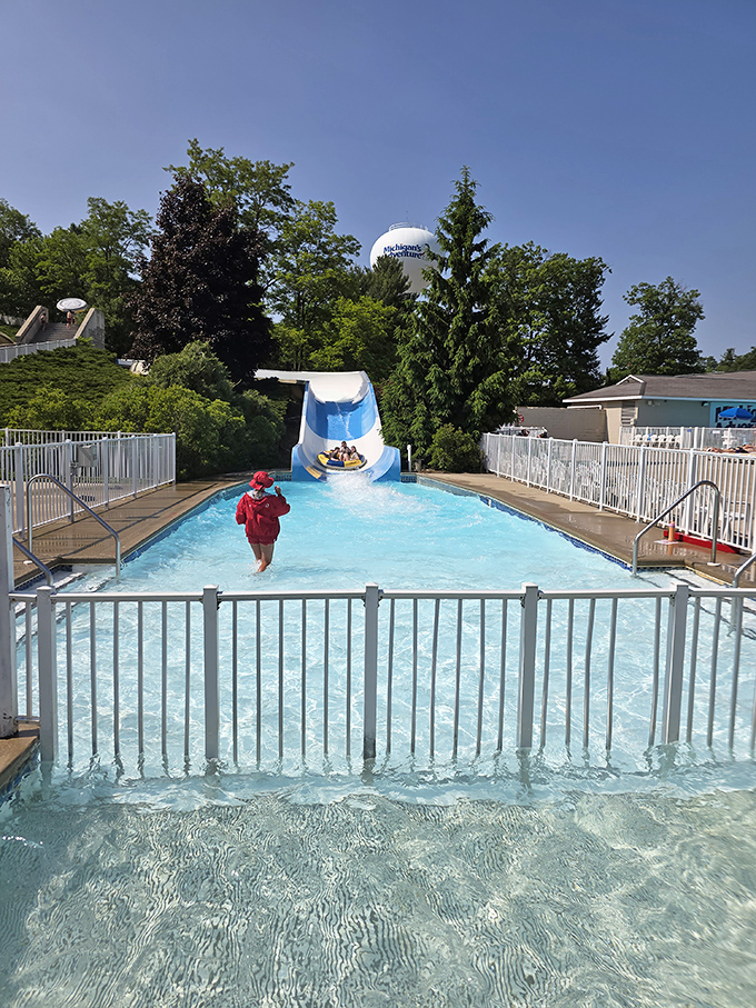 That perfect moment when a water slide deposits its human cargo into the waiting pool &ndash; half splash, half triumphant finale.