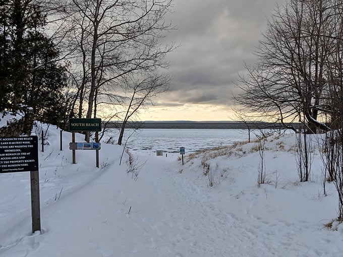 Snow-covered access points lead to winter's version of beach therapy, where the frozen landscape offers a different kind of tranquility.