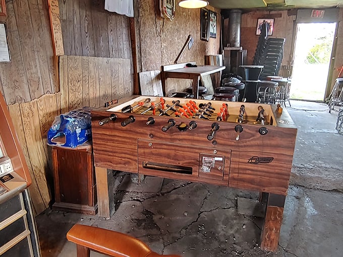 The patron-decorated interior tells thousands of stories through signatures, stickers, and souvenirs accumulated over decades of good times.1. table soccer