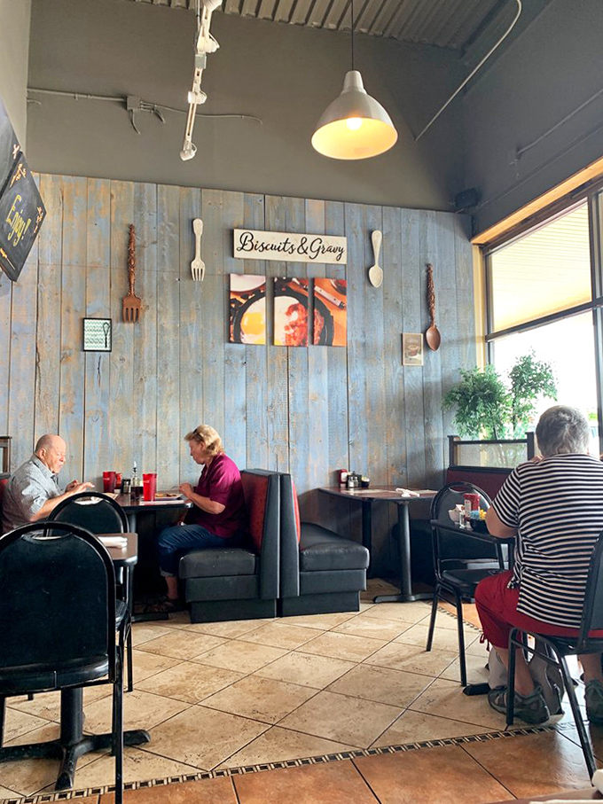 Blue-gray walls and weathered wood panels create the perfect backdrop for morning conversations that flow as freely as the coffee.