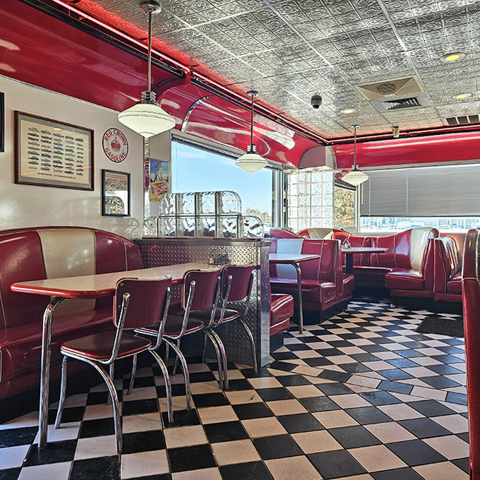 Red vinyl booths invite you to slide in and stay awhile, promising conversations that linger as long as the coffee refills.