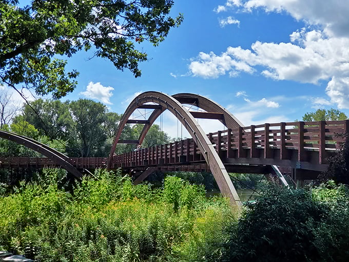 Three paths converge at this wooden crossroads, offering different journeys from a single starting point &ndash; much like life itself.