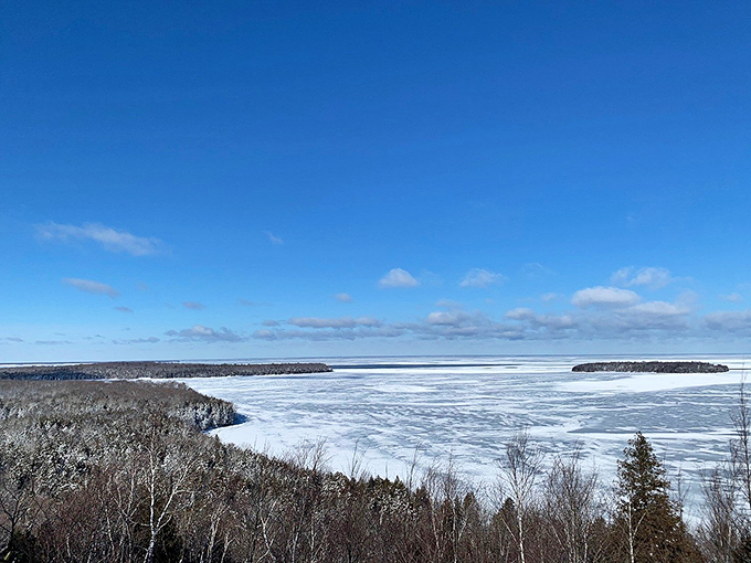 Winter transforms Green Bay into a frozen wonderland, where the horizon between ice and sky blurs into infinity.