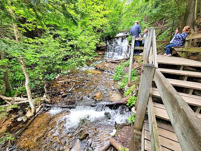 Wooden observation platforms bring visitors face-to-face with cascading waters, where nature's power play unfolds just feet from your amazed expression.