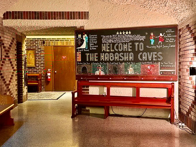 The welcome sign's cheerful chalkboard art contrasts beautifully with ancient stone walls, bridging centuries in one friendly greeting.