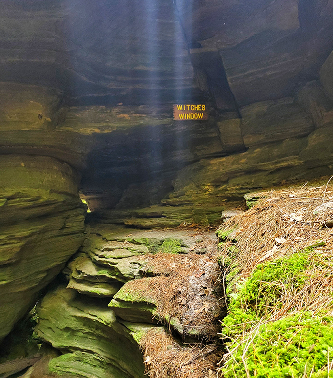 
Witches Window offers a perfect frame of blue sky, where sunbeams dramatically pierce the darkness below. It's nature's spotlight, illuminating the ancient passageway.