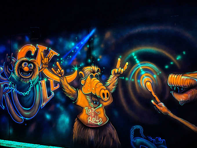 The resident blacklight creatures seem to be hosting their own little rock concert while you attempt to focus on your putting game.