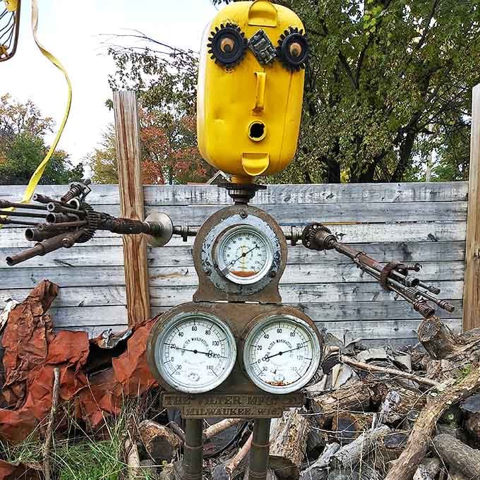 This yellow-headed creation watches with gear-eyes, its body a complex arrangement of gauges that measure nothing but imagination.