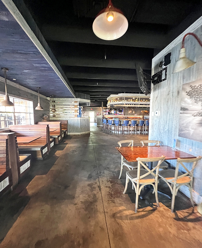 Another angle reveals the thoughtful design &ndash; weathered wood, strategic lighting, and enough space between tables for private conversation or friendly mingling.