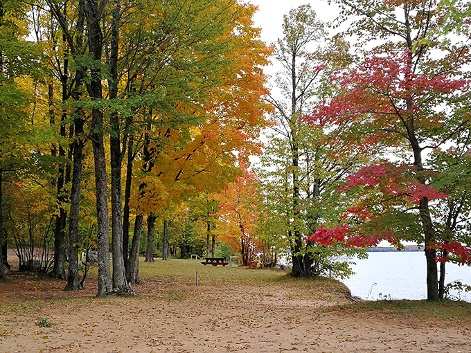 Fall foliage creates a frame of fiery colors around the shoreline, like Mother Nature's version of a perfectly filtered Instagram post.