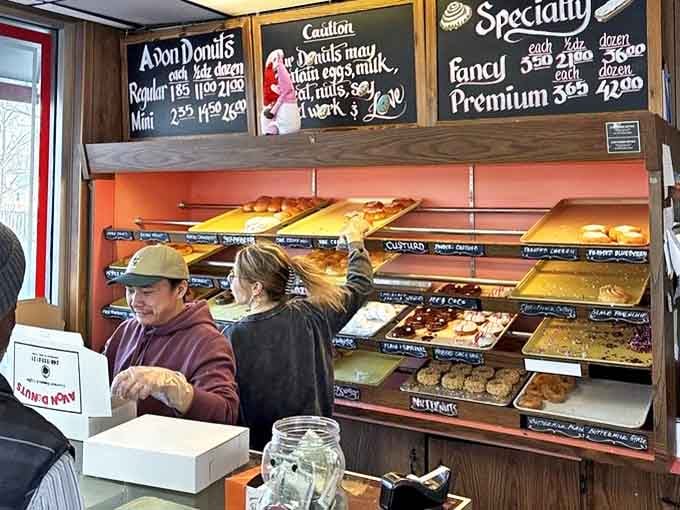 The counter service area where donut dreams come true, staffed by folks who understand the importance of their sacred mission.