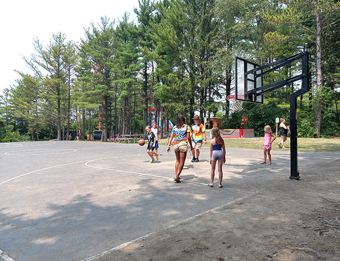 The basketball court offers a chance to showcase skills that somehow seem more impressive after a day of water-based humility lessons.