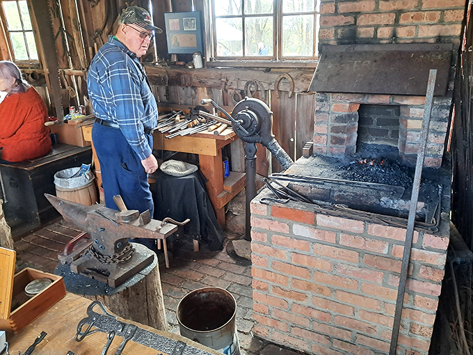 The blacksmith shop glows with purpose, demonstrating craftsmanship that makes modern "artisanal" products seem suspiciously mass-produced.