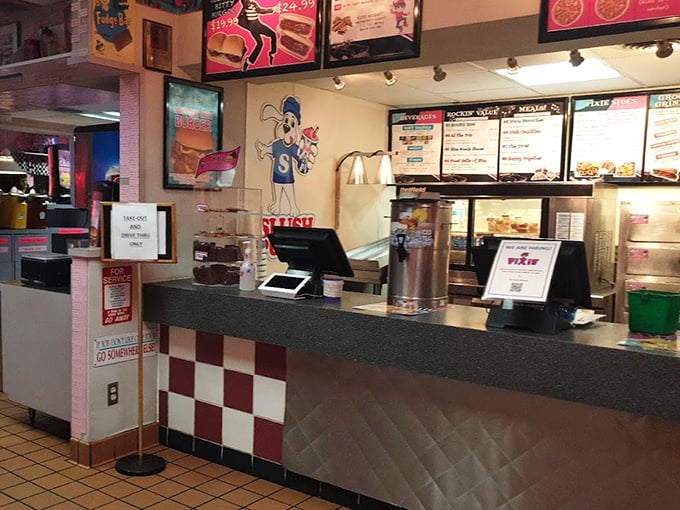 The ordering counter features the Pixie mascot, ready to welcome hungry visitors to this time-traveling culinary experience.