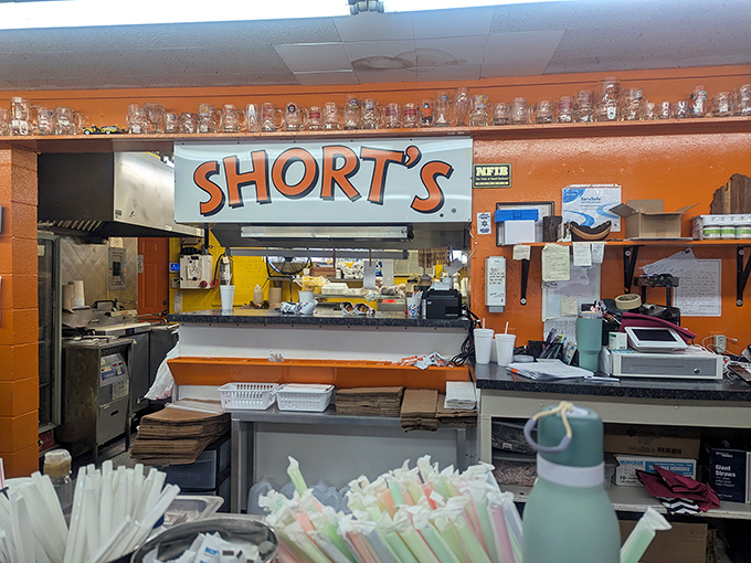 The heart of the operation, where orders are called and food appears with remarkable speed, no fancy technology required.