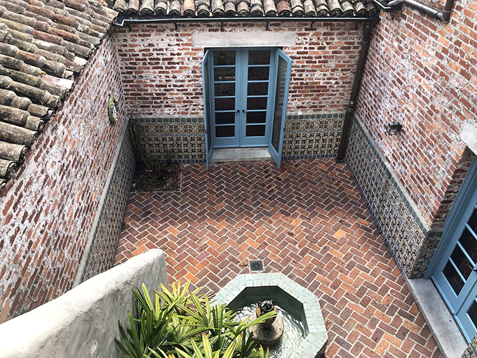 This courtyard whispers secrets of Spanish design traditions, complete with fountain and brickwork that modern landscaping can only dream of achieving.