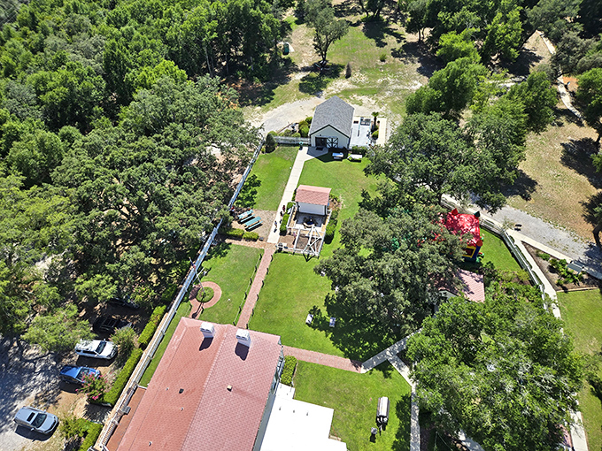 An aerial perspective reveals the lighthouse grounds in their full glory &ndash; a historical compound nestled between naval facilities and natural beauty.