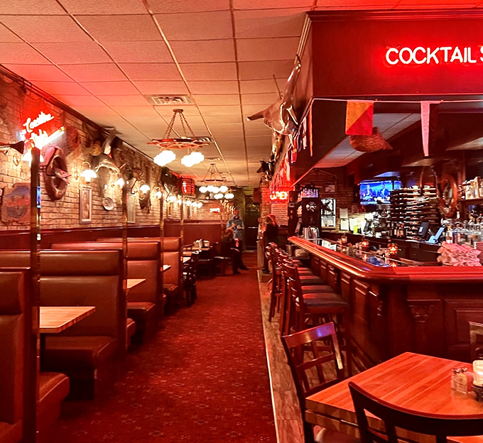 Red booths and warm lighting create the perfect setting for cracking shells and making memories.