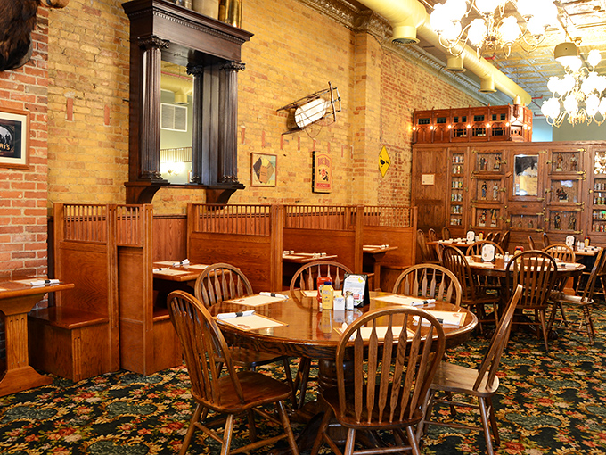 Cozy wooden booths create intimate dining spaces where countless celebrations, first dates, and family gatherings have unfolded over the years.